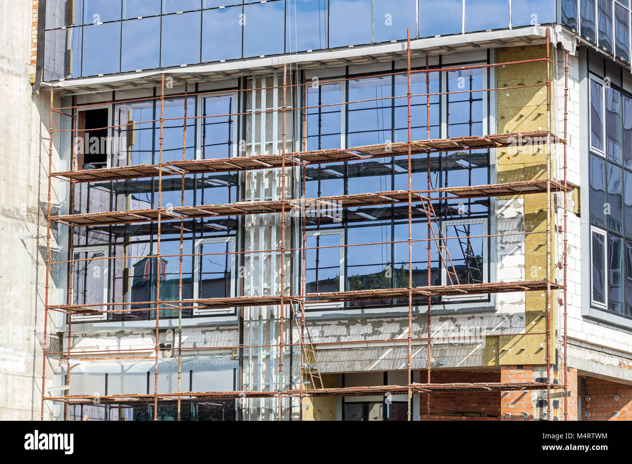 glass office building under construction. building site with ...