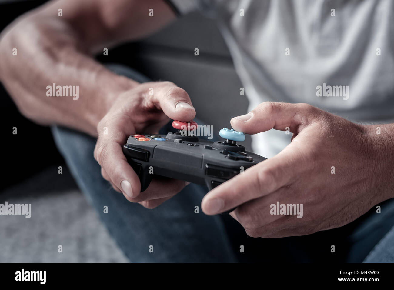 Man holding game controller hi-res stock photography and images - Alamy