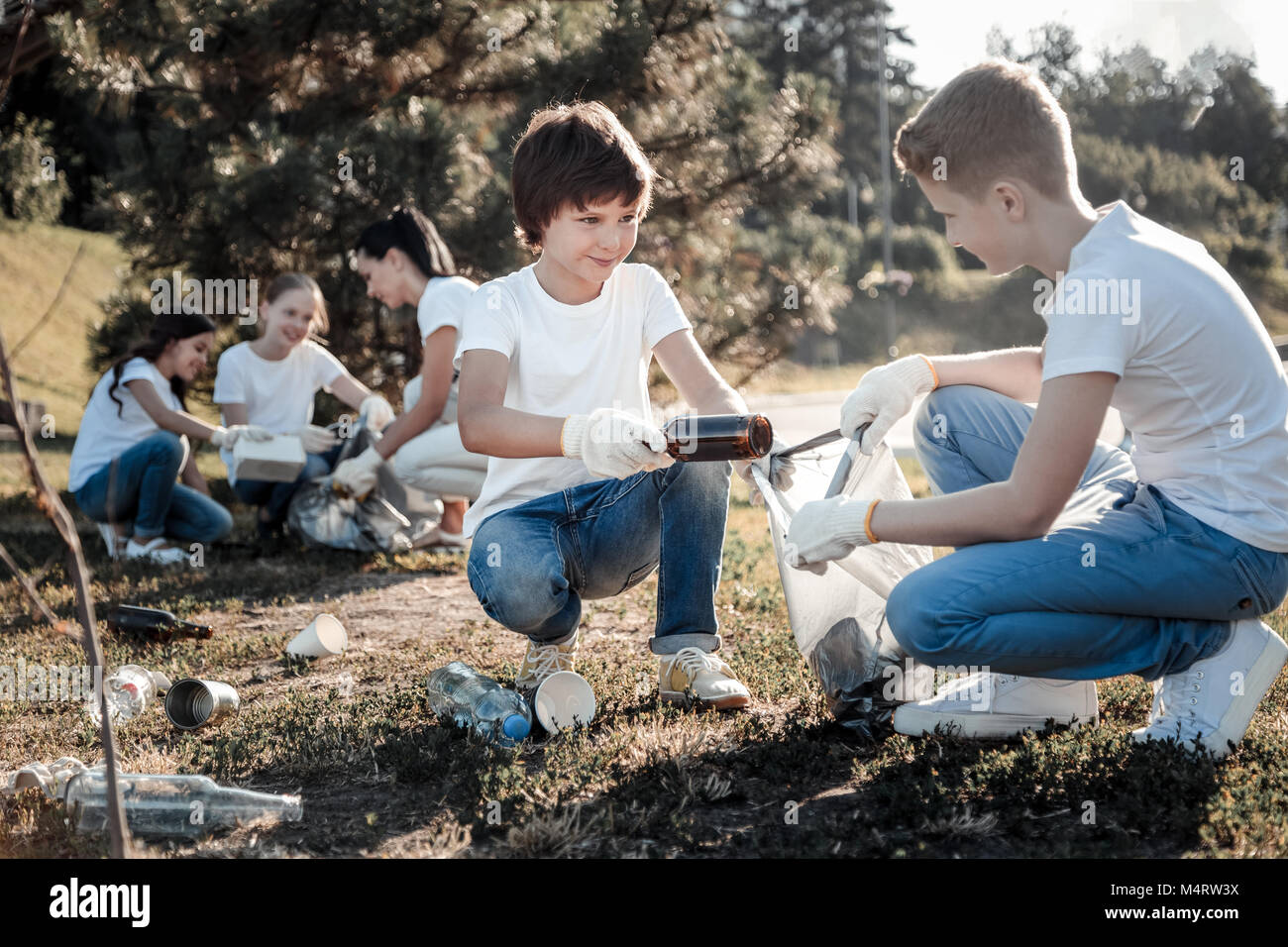 Children collecting litter hi-res stock photography and images - Alamy