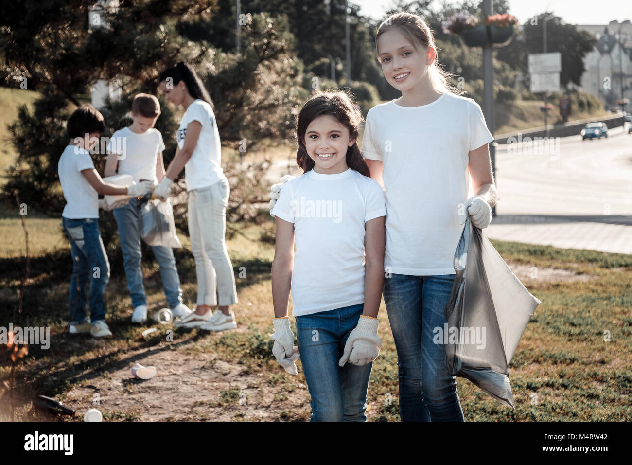 Cheerful nice girls looking at you Stock Photo - Alamy
