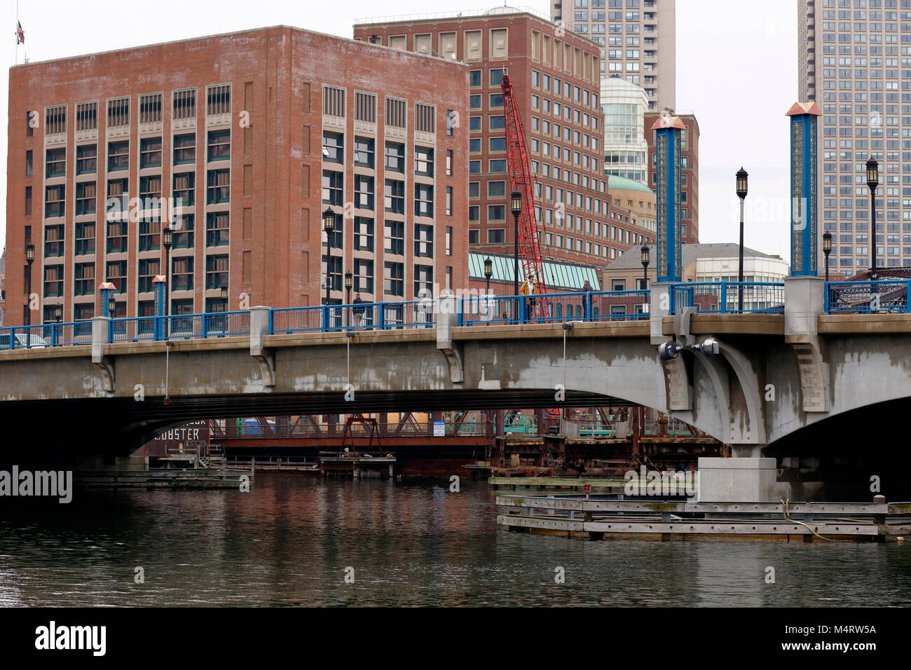 A tech worker on the Seaport Blvd Bridge walking toward the Seaport ...