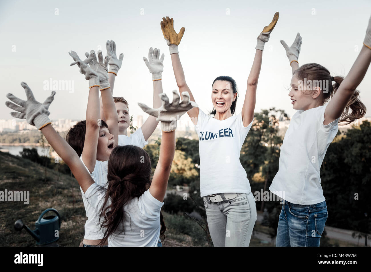 Happy joyful team raising their hands Stock Photo - Alamy