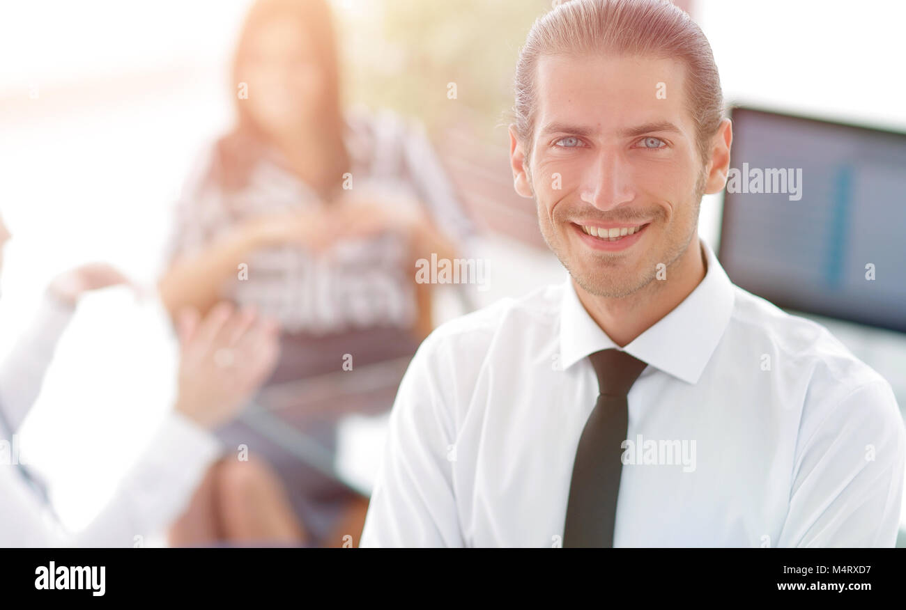 successful young business men on blurred background Stock Photo - Alamy