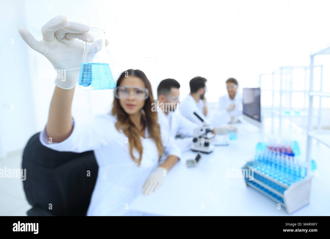 group of young scientists working in the laboratory Stock Photo - Alamy