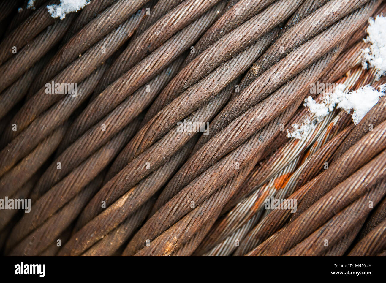 rusty steel rope with snow Stock Photo - Alamy