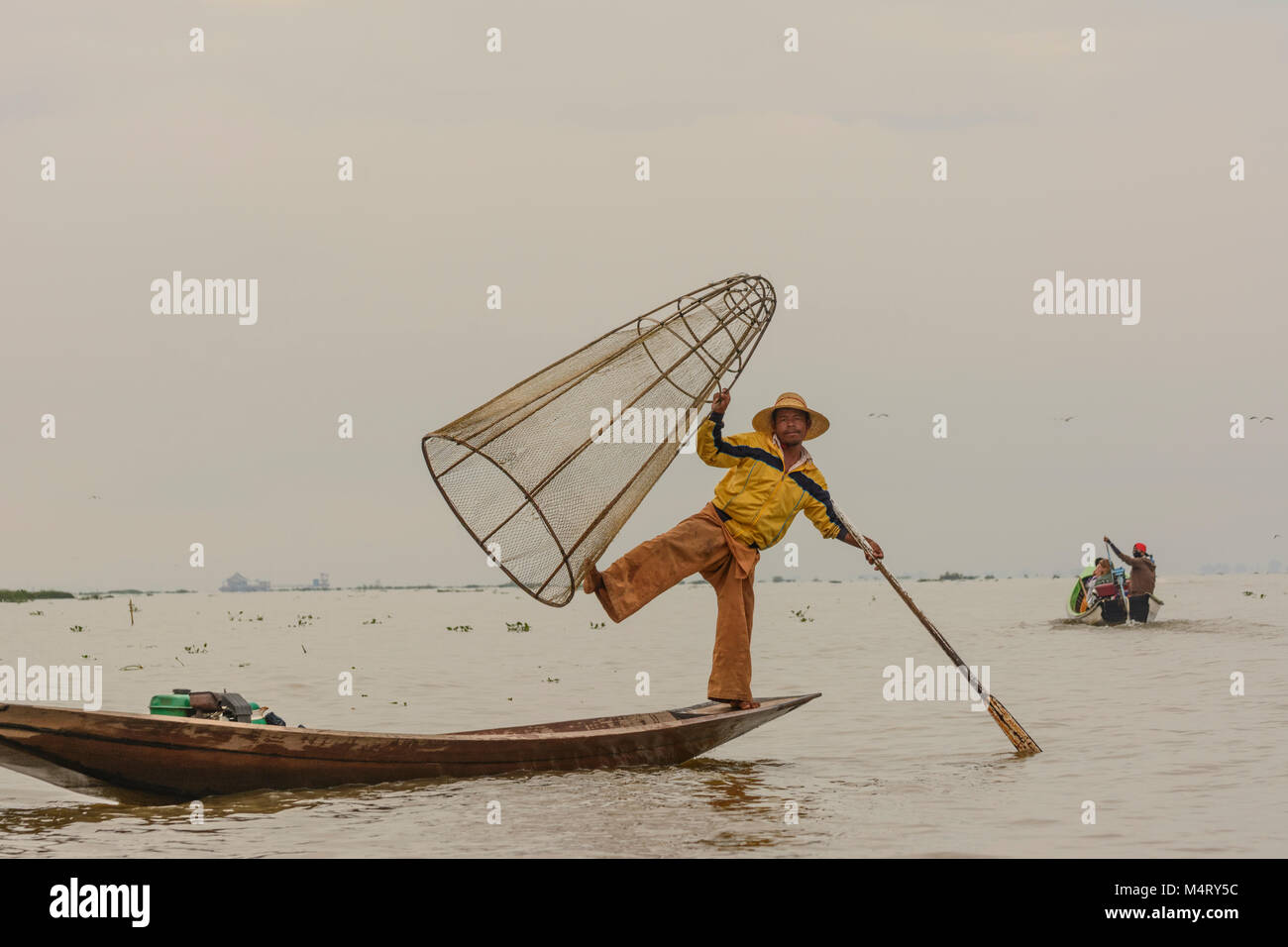 Nyaung Shwe: Fisherman at Inle Lake with traditional Intha conical net ...