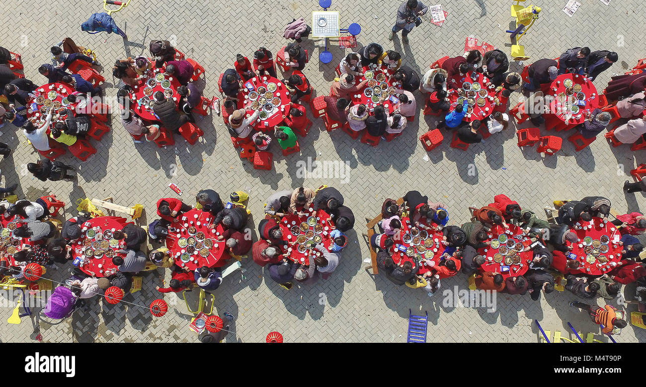 Beijing, China's Jiangxi Province. 13th Feb, 2018. Villagers gather ...