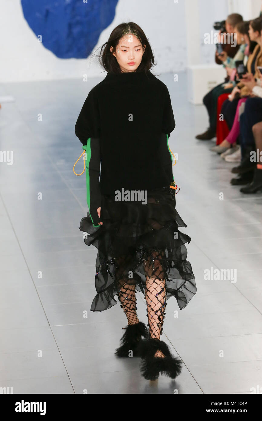 London, UK. 18th Feb, 2018. A model walk the runway at the Preen by ...