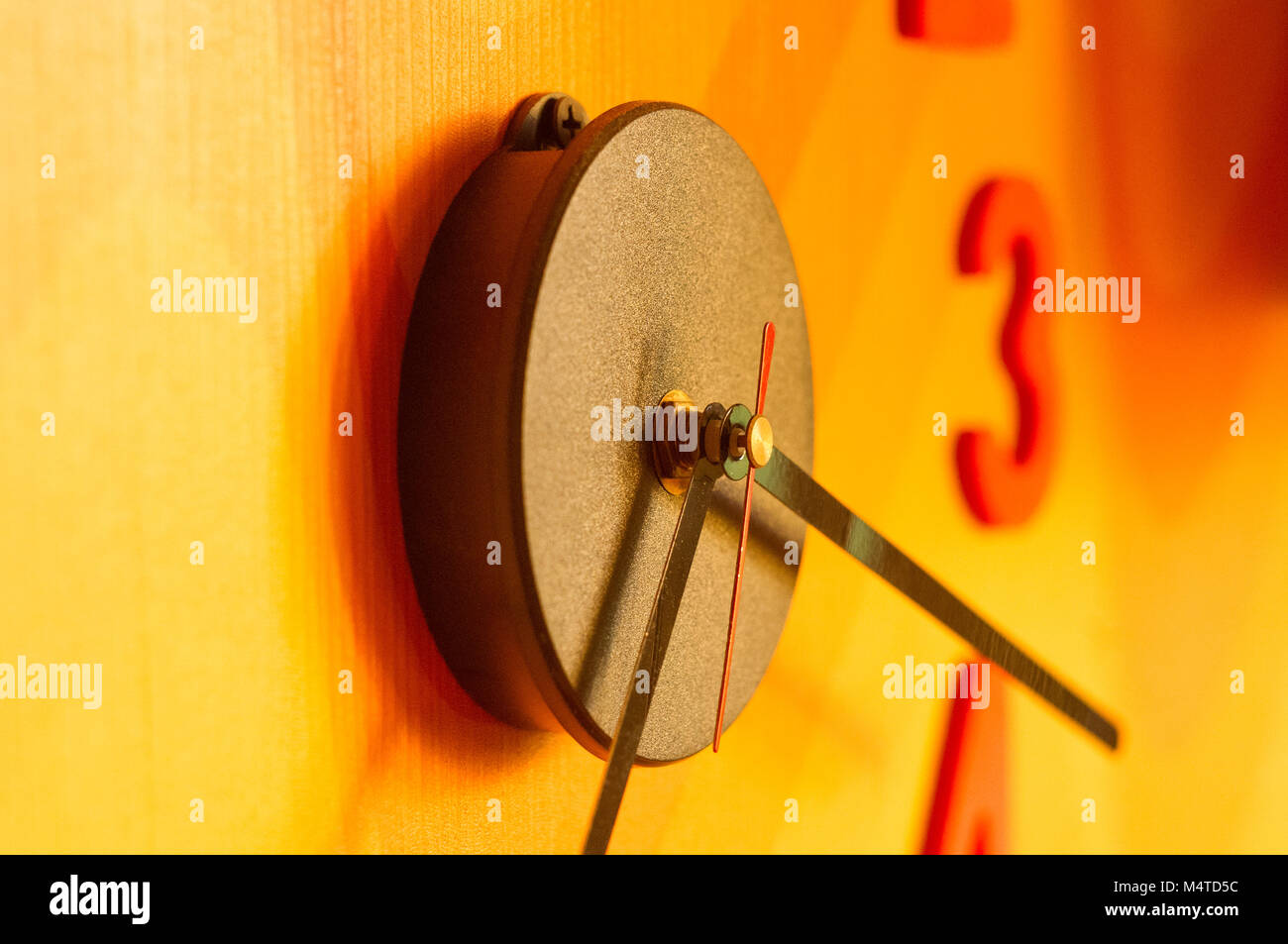 large wall clock with colorful numbers, close up Stock Photo - Alamy