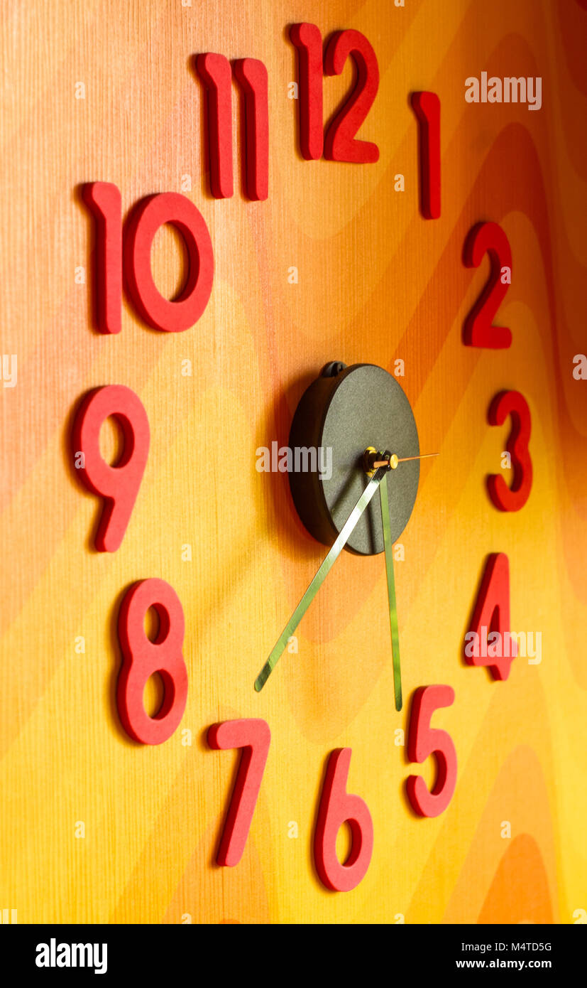 large wall clock with colorful numbers, close up Stock Photo - Alamy