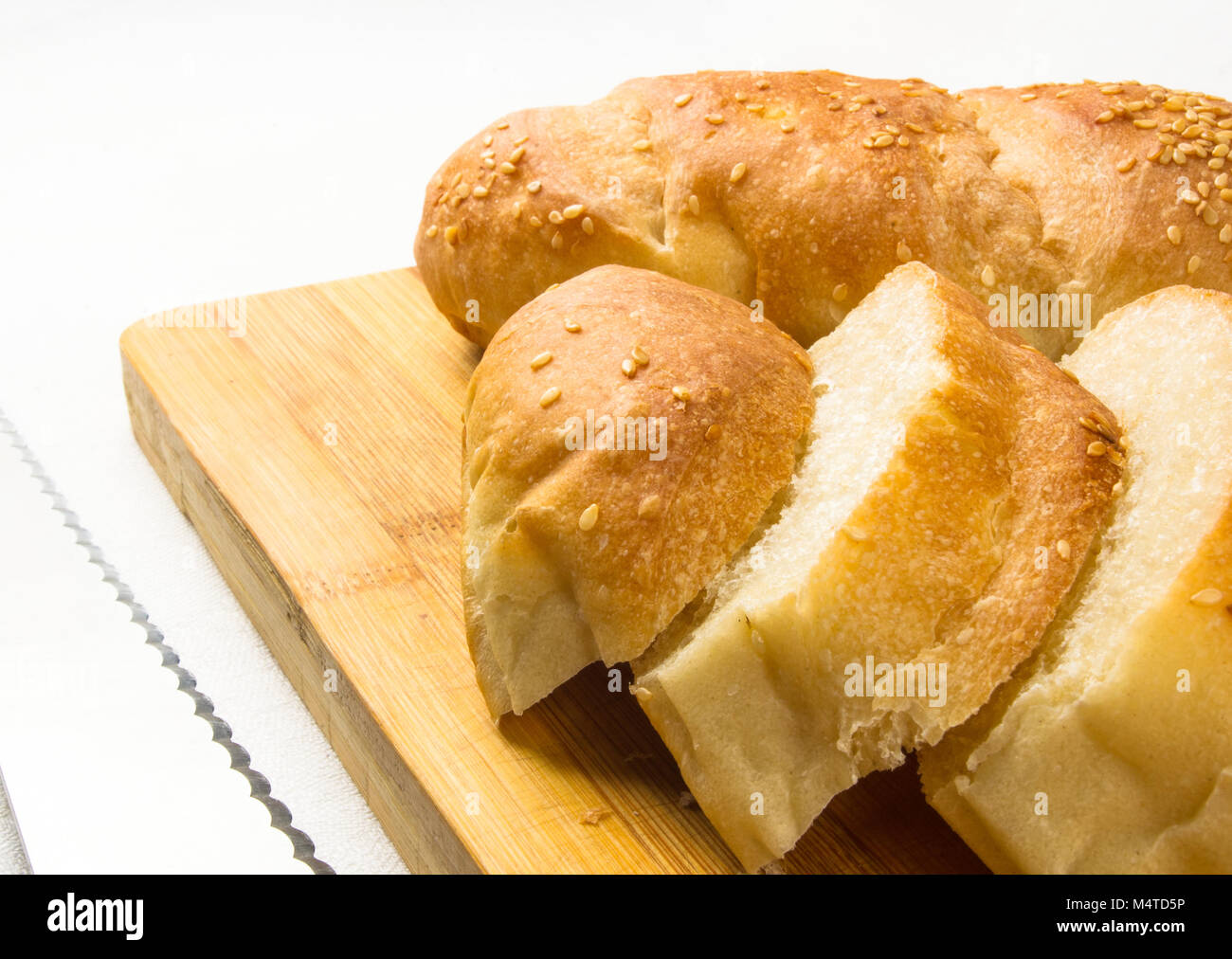 sliced whole wheat breads with a knife on a chopping Board Stock Photo ...