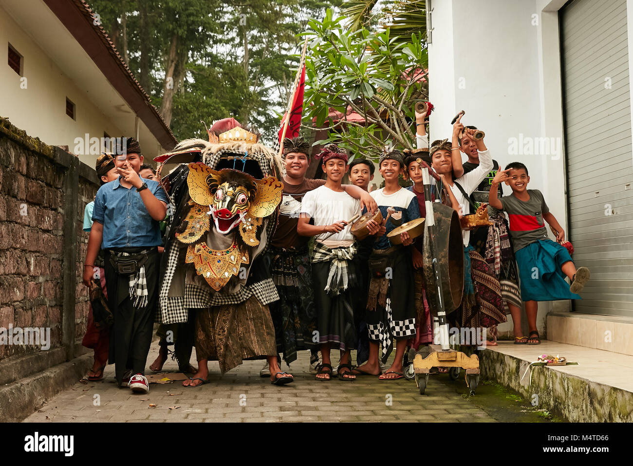 Local indonesian boys performing traditional lion dance with musical ...
