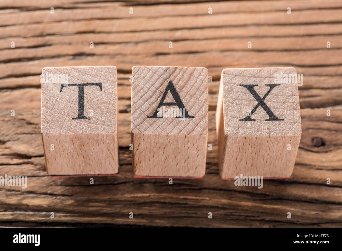 Elevated View Of Tax Blocks On Wooden Background Stock Photo - Alamy