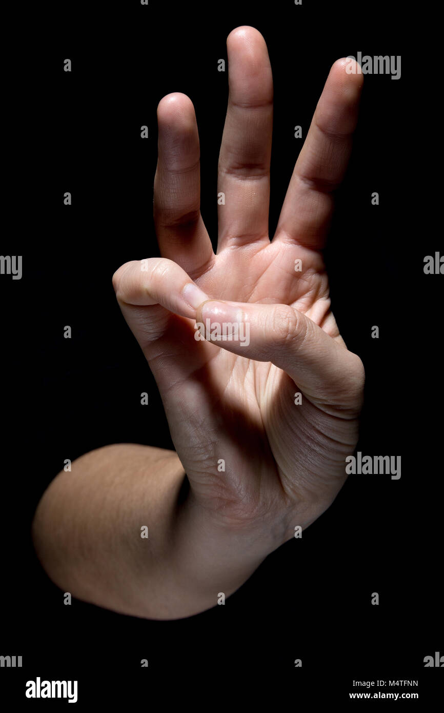 hand in mudra gesture position on black background Stock Photo - Alamy