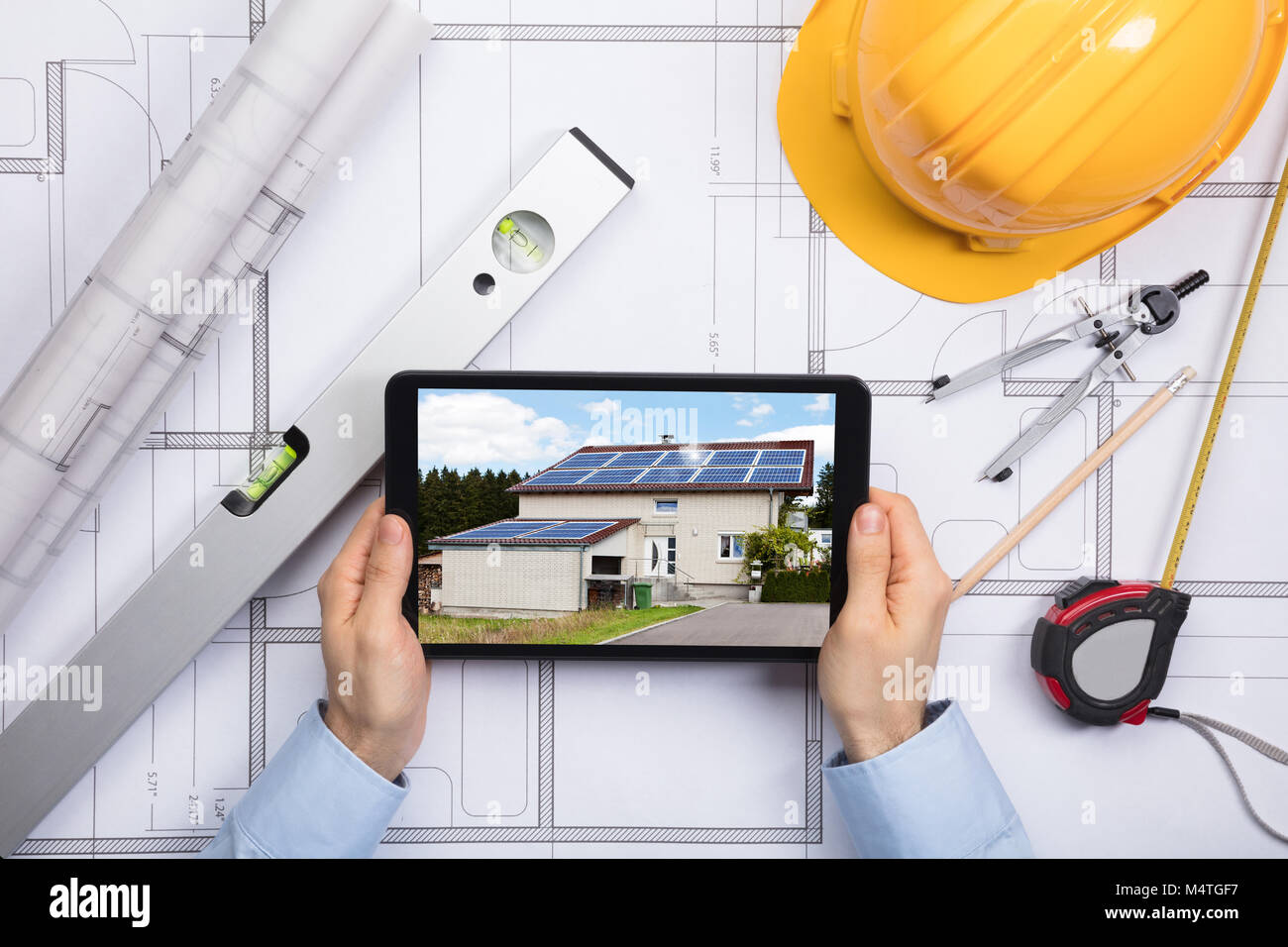 Engineer working tablet blueprint hi-res stock photography and images ...