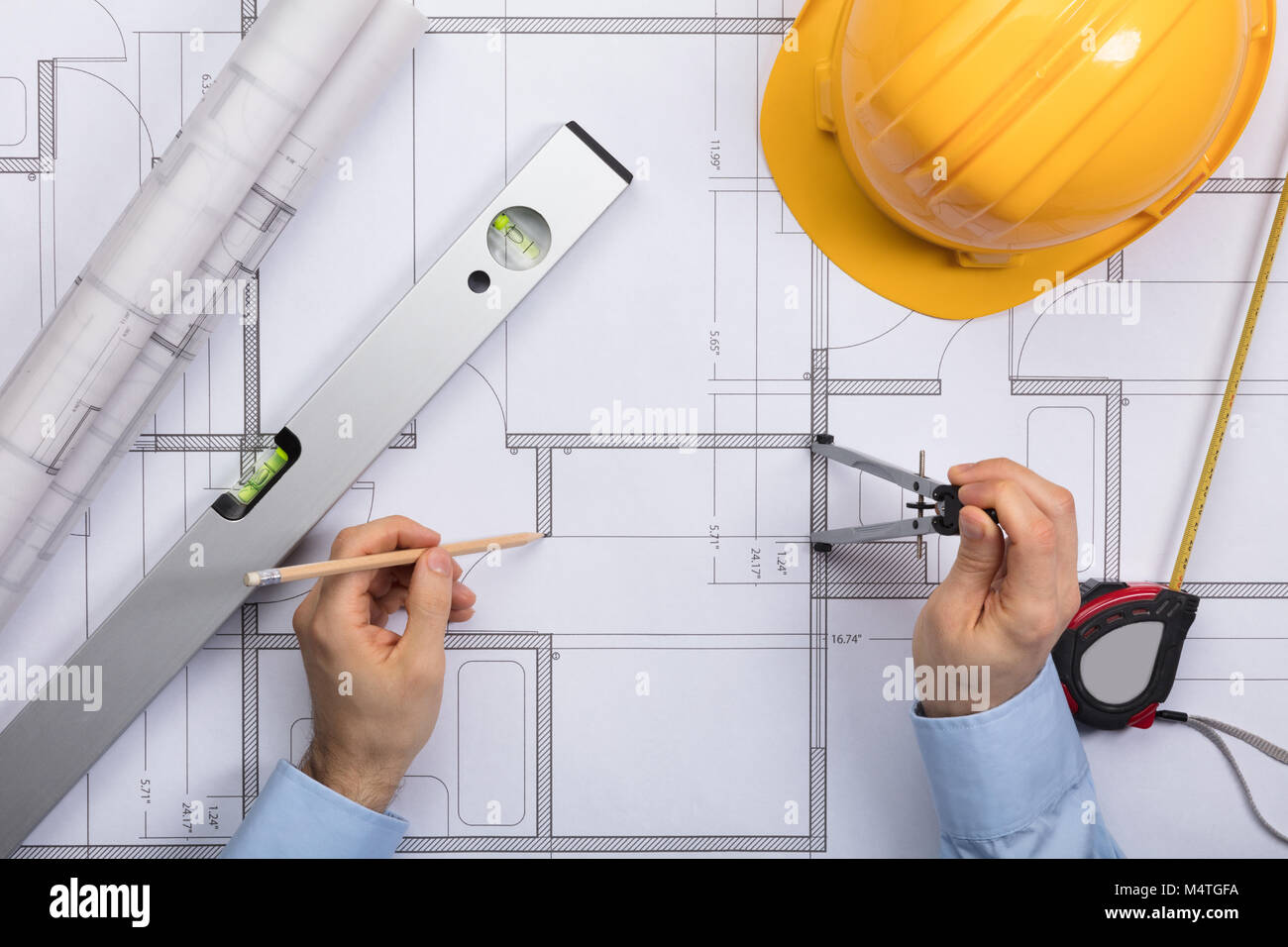 High Angle View Of Architect Hands Working On Blueprint Stock Photo - Alamy