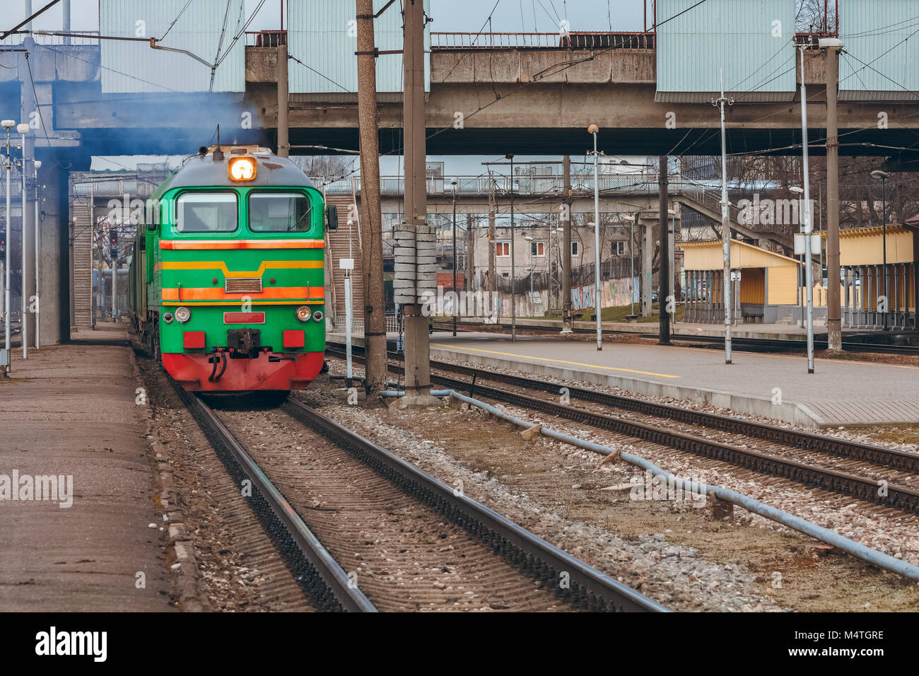 Green diesel cargo locomotive. Freight train in action Stock Photo - Alamy