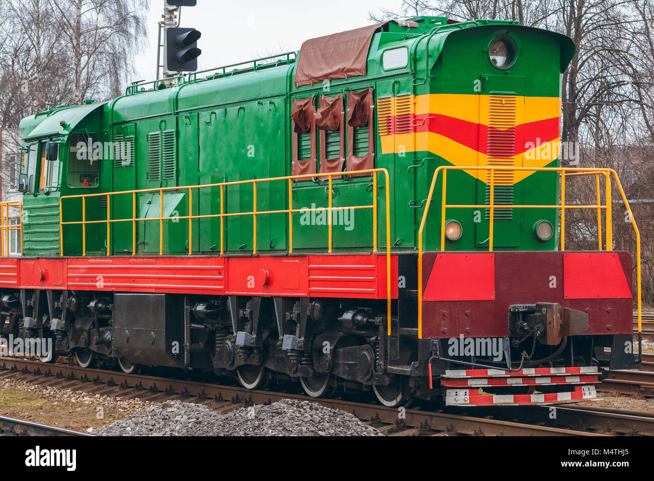 Green diesel cargo locomotive. Freight train in action Stock Photo - Alamy