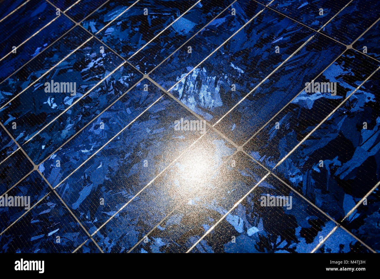 Sun reflecting in roof solar panel system that absorbs sunlight to ...