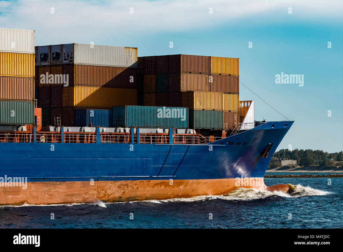 Blue container ship in travel. Logistics and freight industry Stock ...