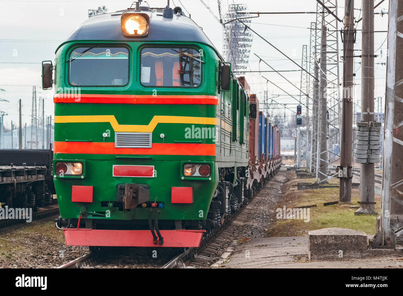 Green diesel cargo locomotive. Freight train in action Stock Photo - Alamy