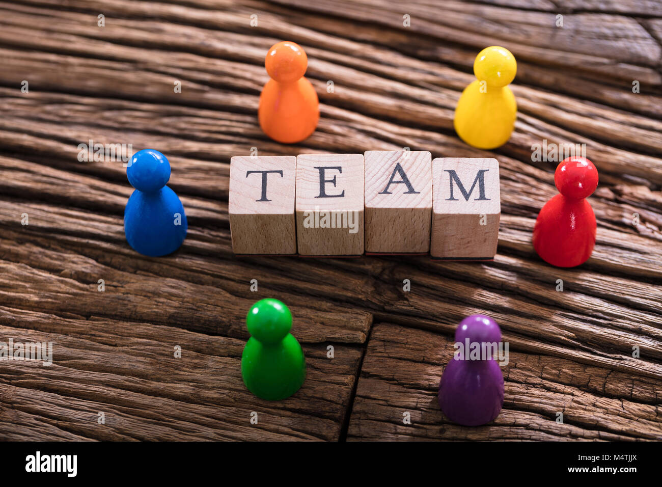 High Angle View Of Team Word On Wooden Block With Multi Colored ...