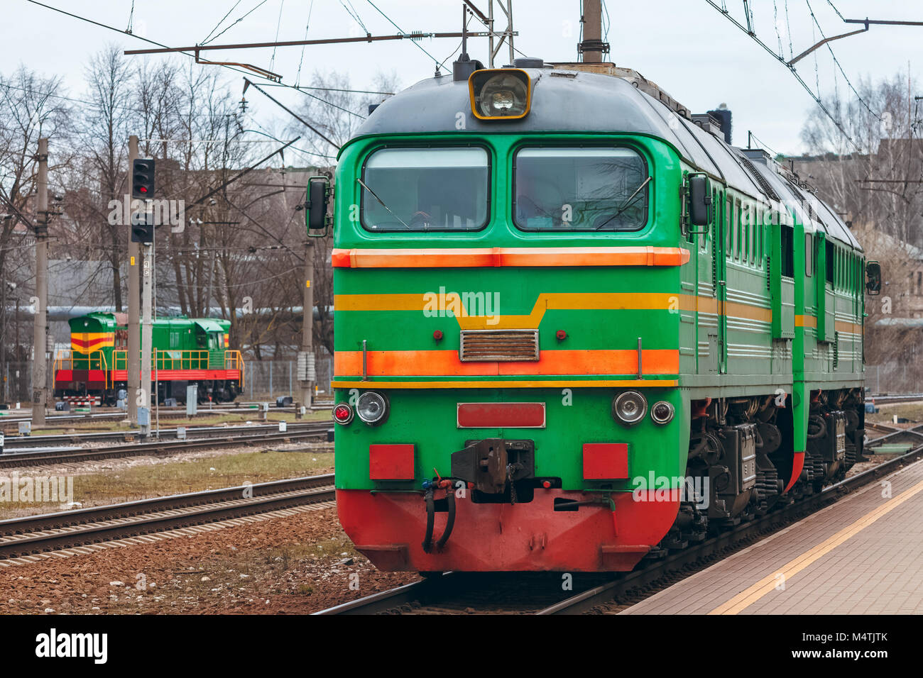 Green diesel cargo locomotive. Freight train in action Stock Photo - Alamy