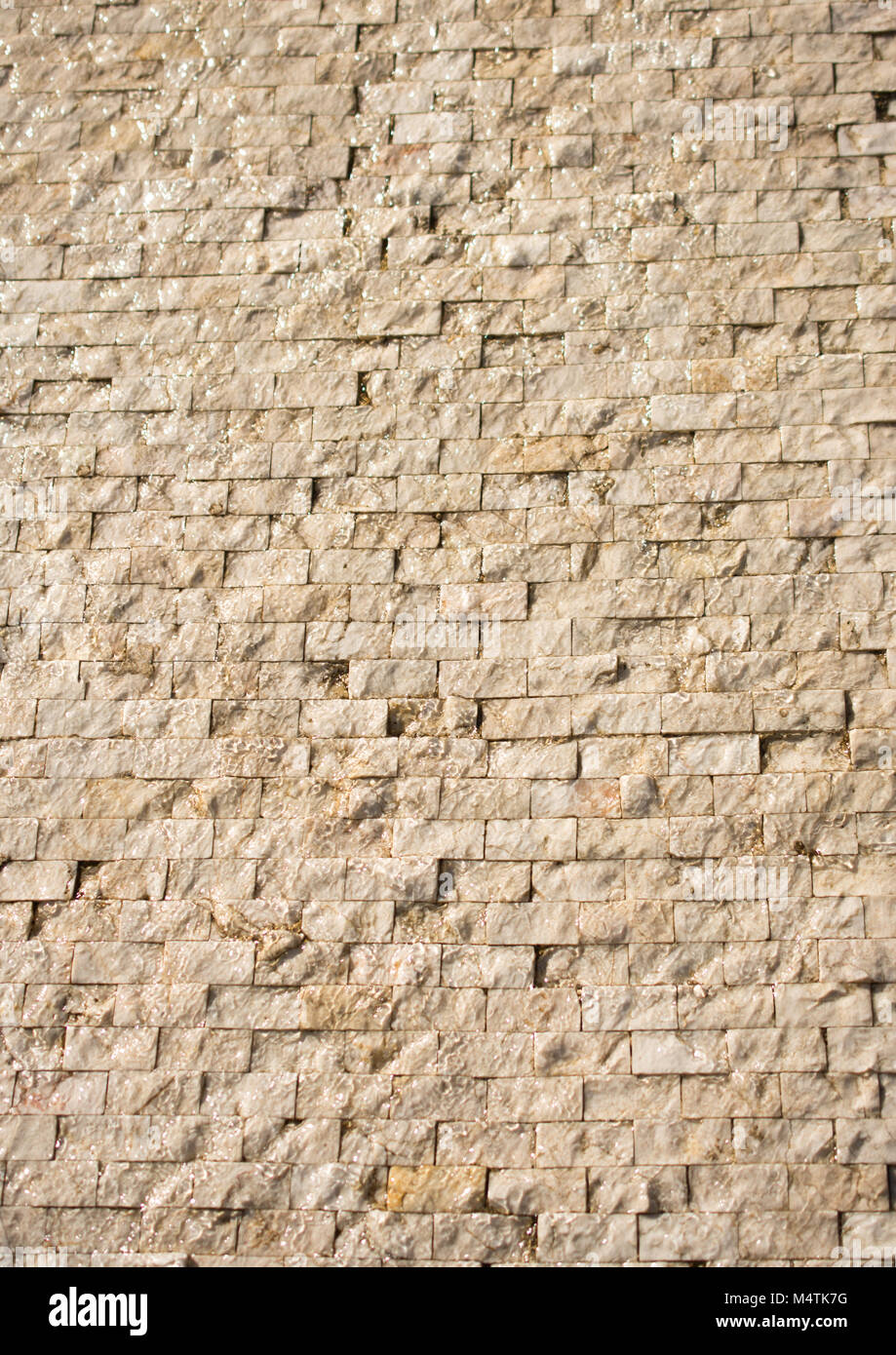 Decorative stone background built of little stones Stock Photo - Alamy