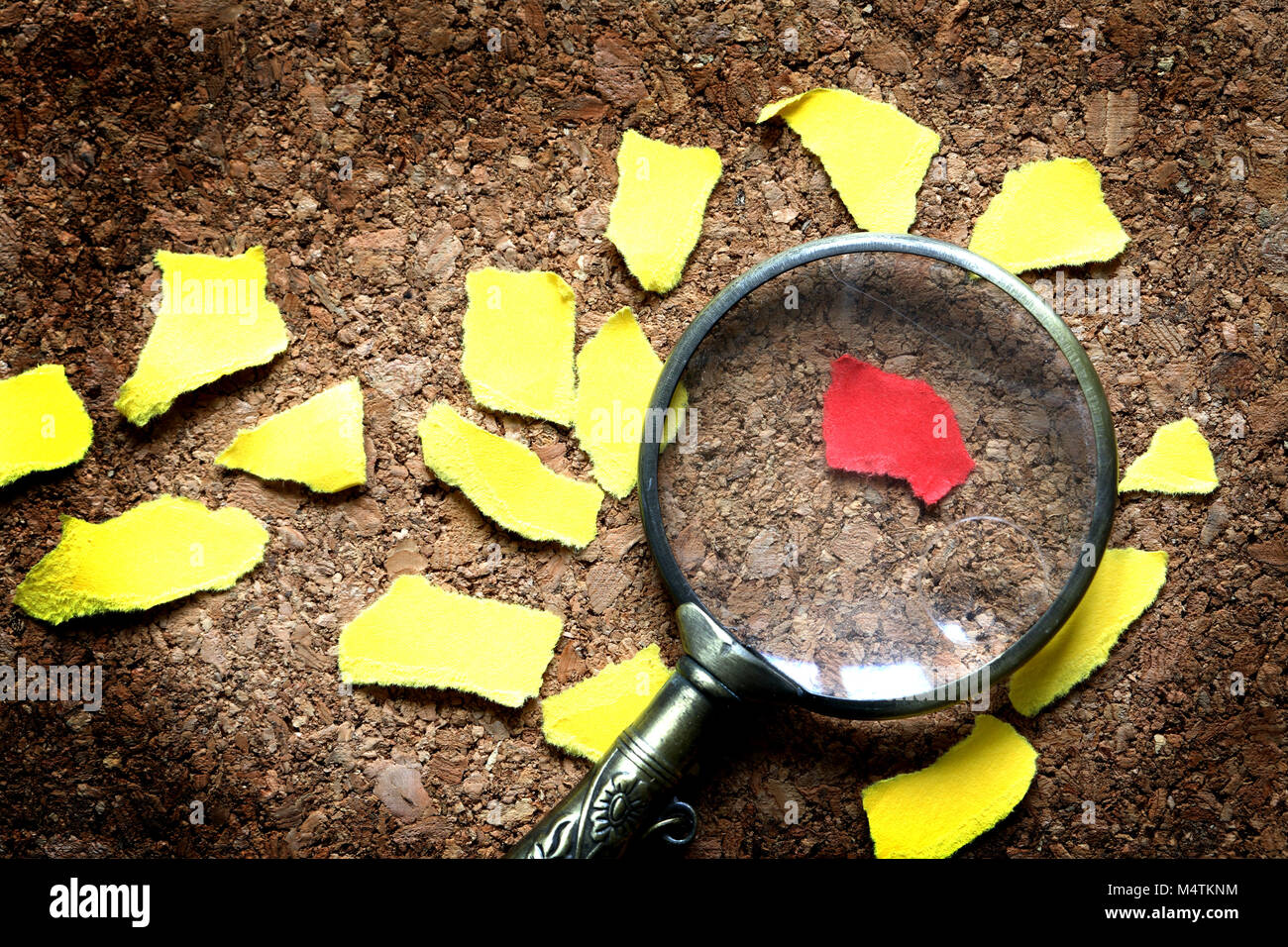 Retro detective concept. Vintage magnifying glass and paper scraps on ...