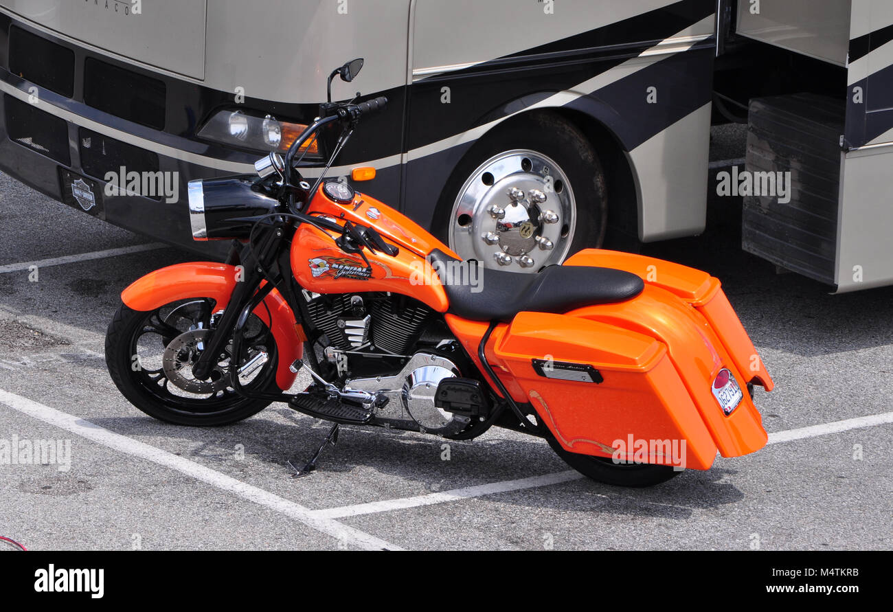 Single Orange Color Custom Motorcycle with Saddlebags Stock Photo - Alamy