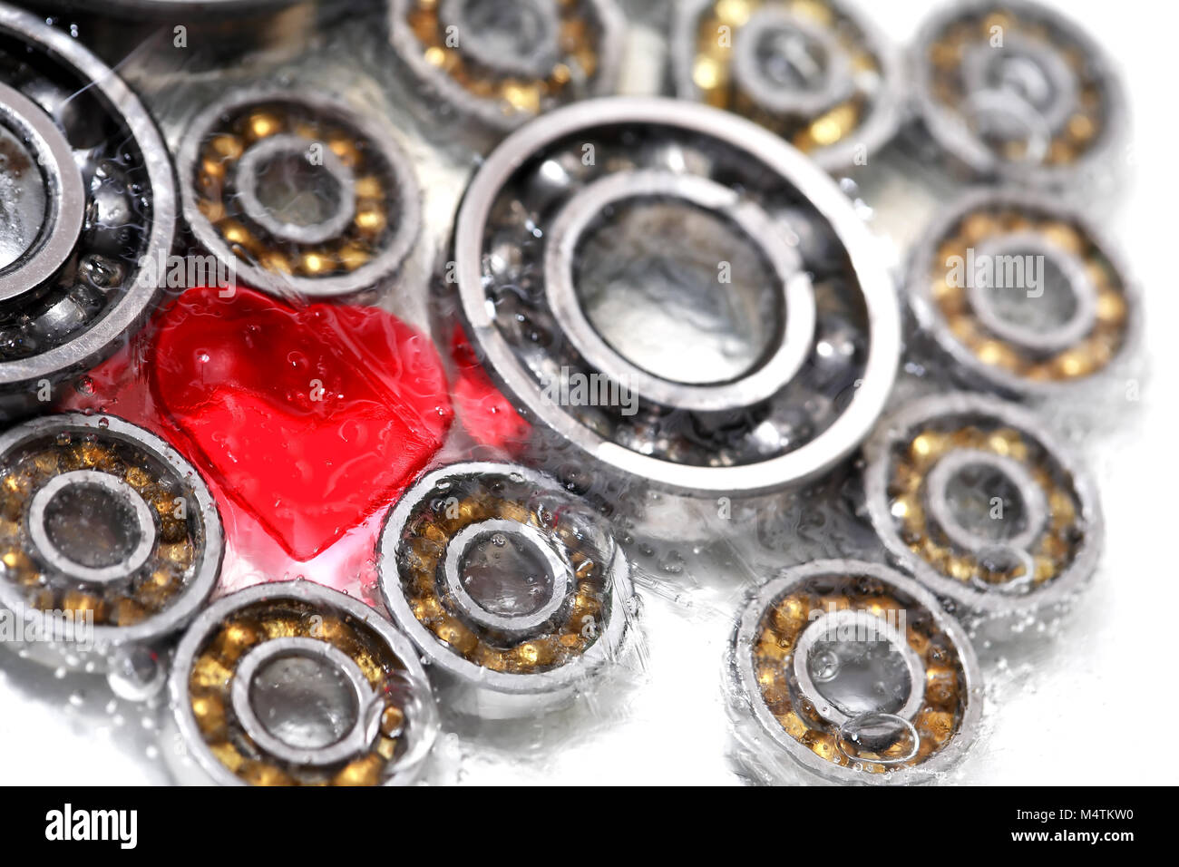 Valentines Day greeting card. Red heart between ball bearings in frozen ...