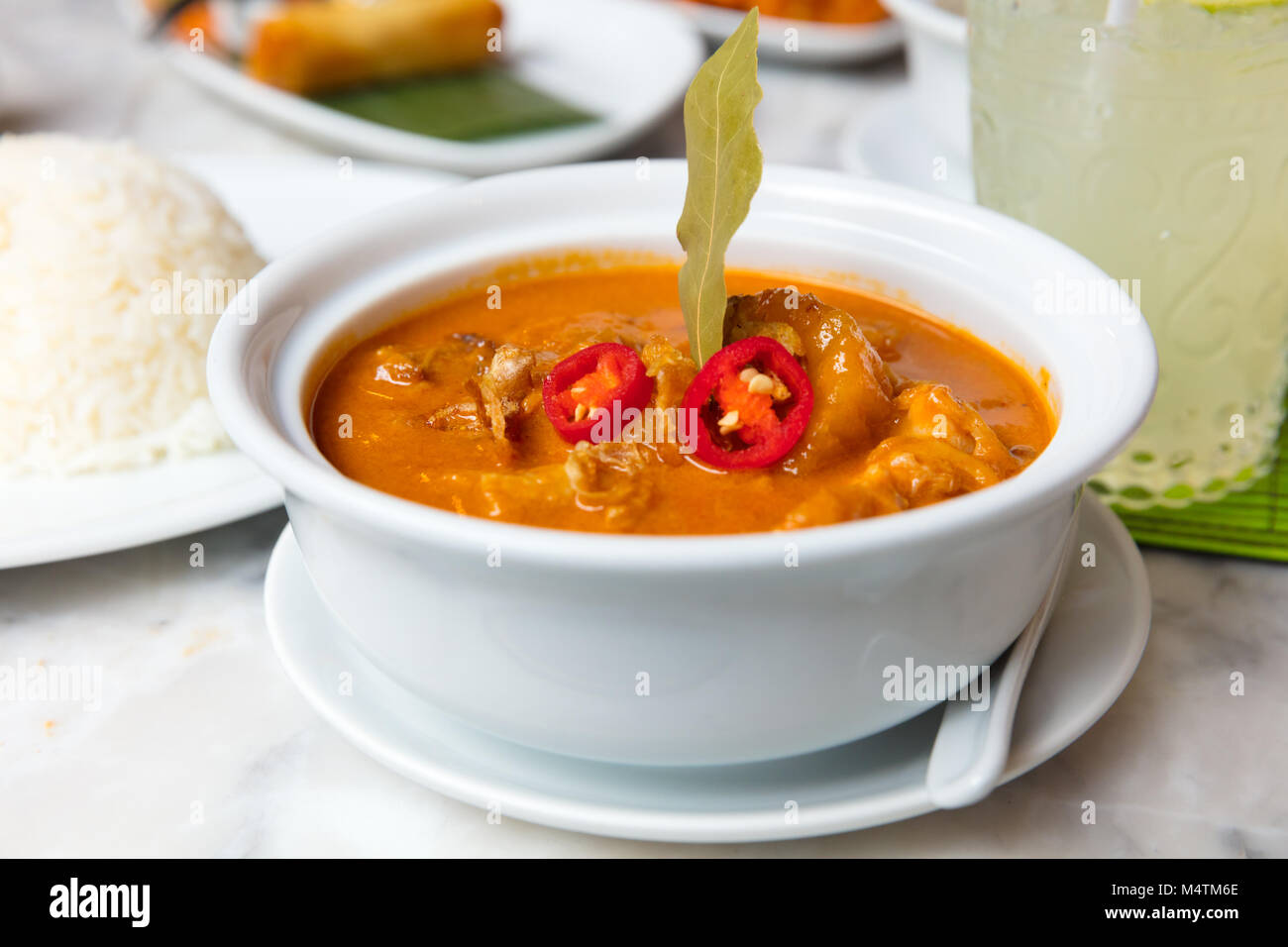 Massaman Duck Curry Served In Bowl At Restaurant Stock Photo - Alamy