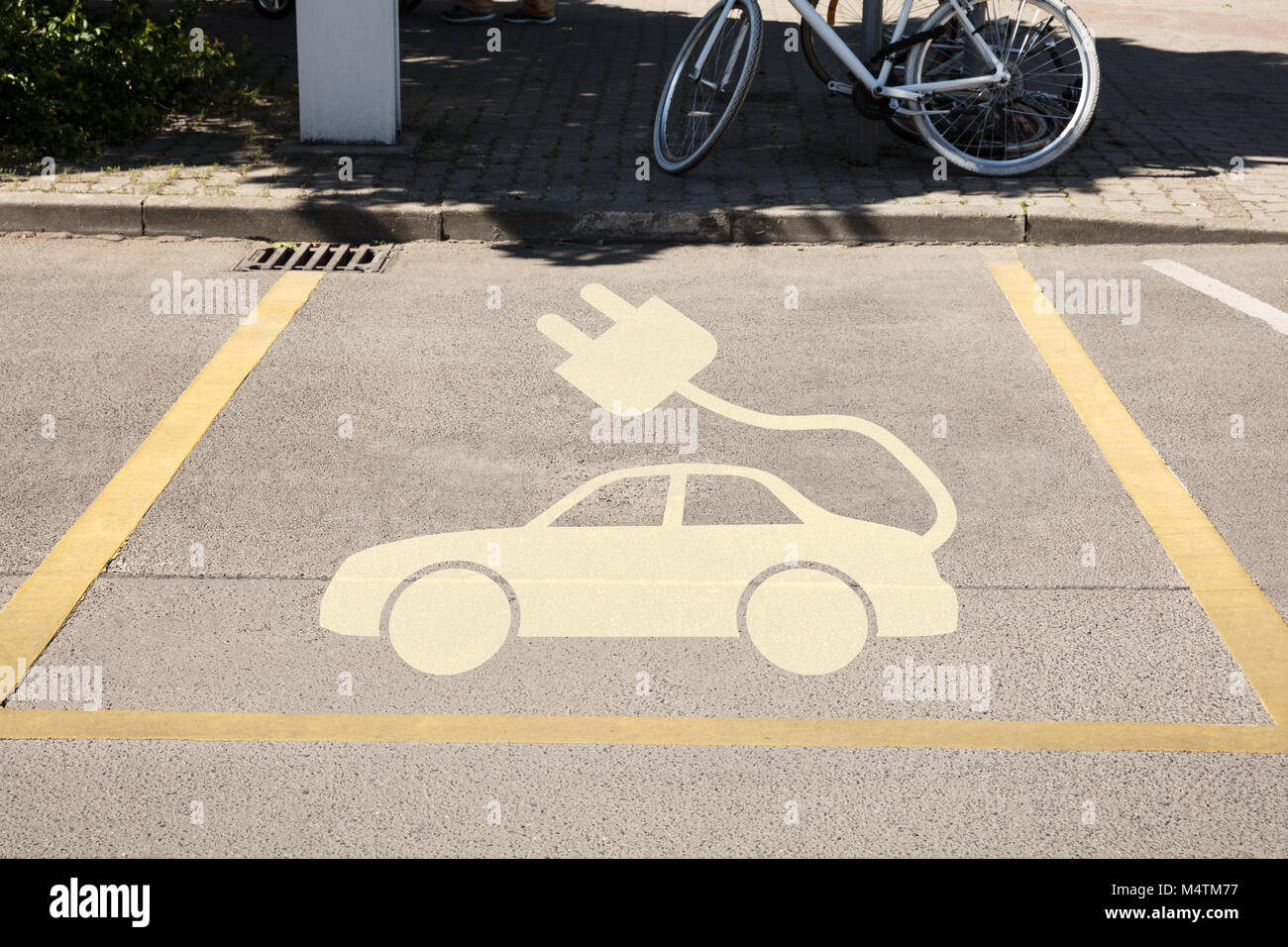 High angle view of electric car sign in parking area Stock Photo - Alamy