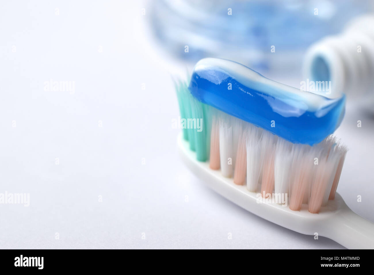 Toothbrush and toothpaste on blurred background - closeup Stock Photo ...