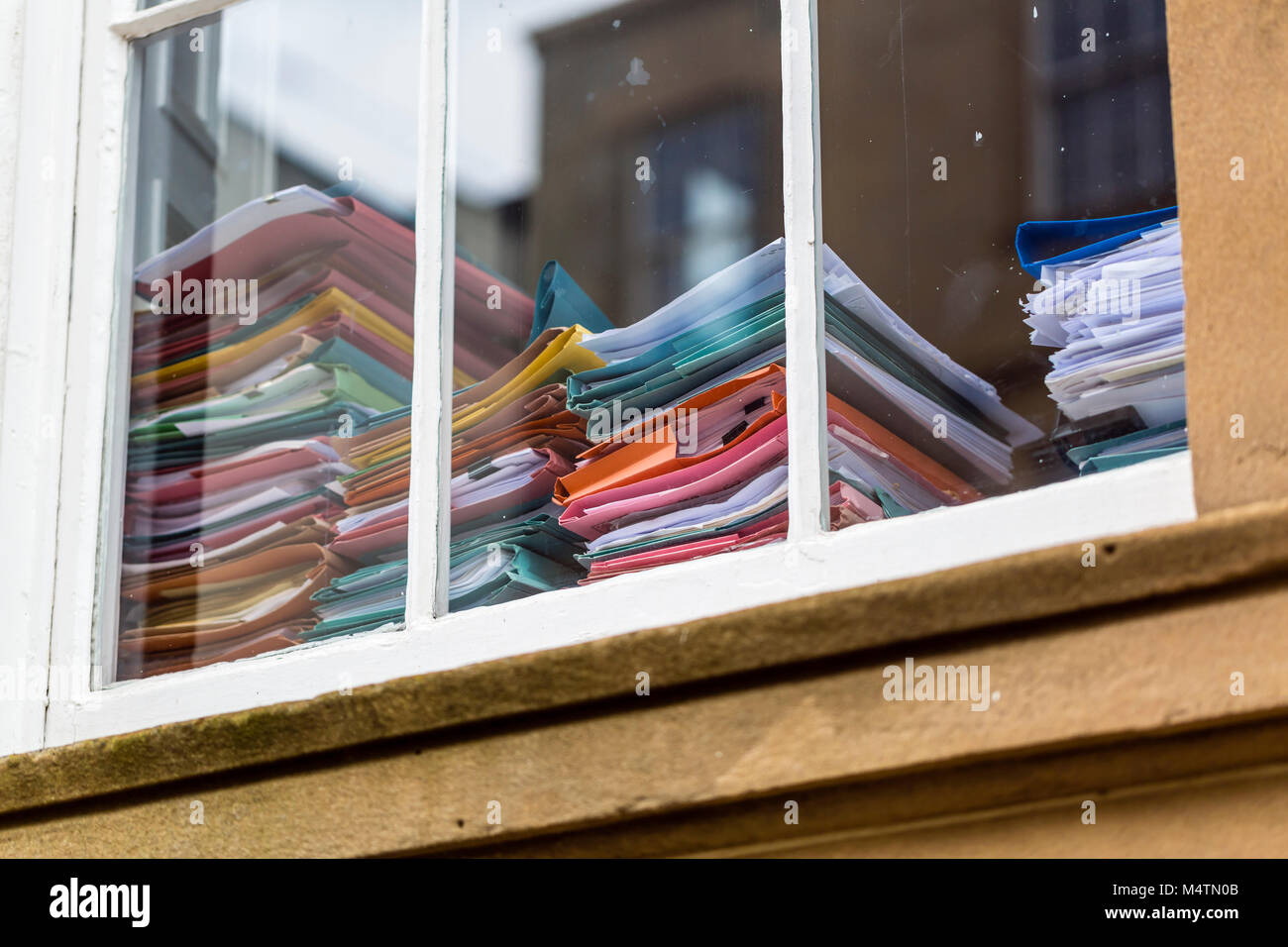 Looking through a window to files in an office Stock Photo - Alamy
