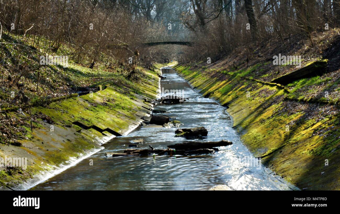Small river with bridge background Stock Photo - Alamy