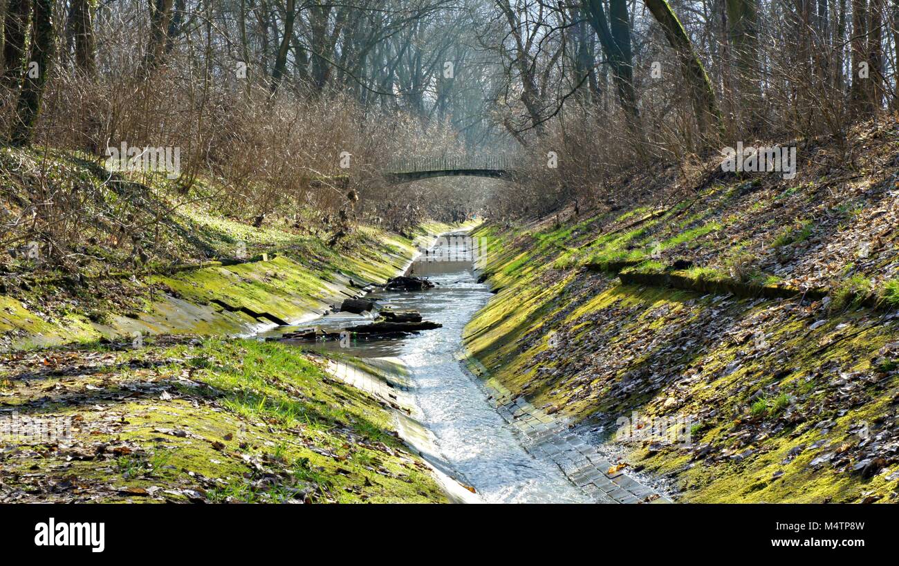 Small river with bridge background Stock Photo - Alamy