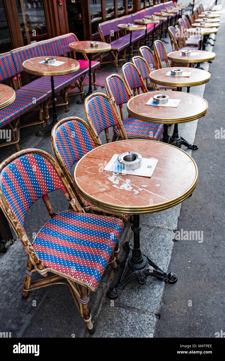 Round tables and chairs in cafe in Paris Stock Photo - Alamy