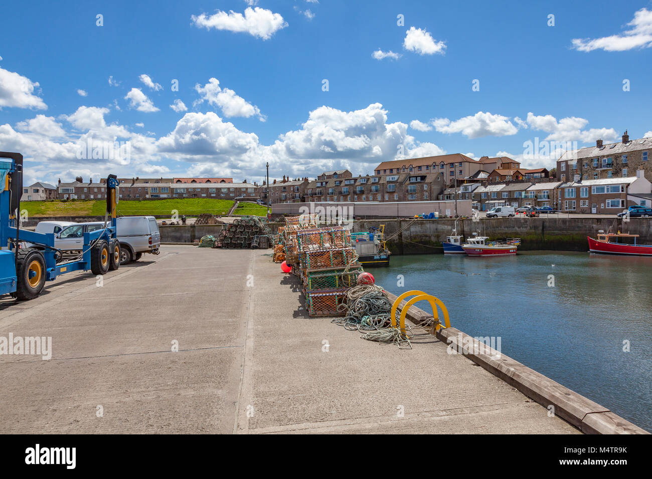 Views of Seahouses harbour in Northumberland under a sunny blue sky,UK ...