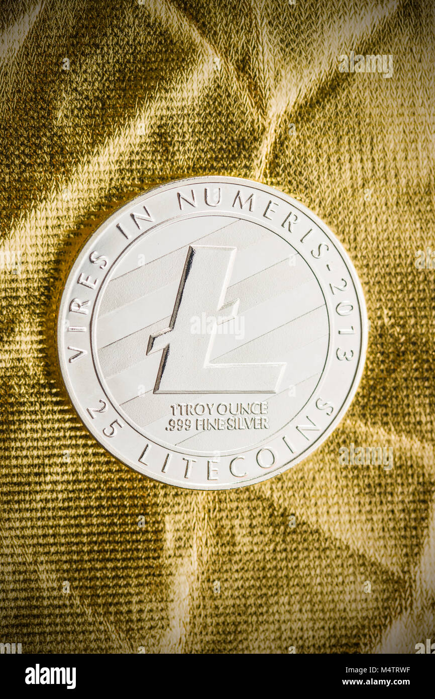 Litecoins. Digital cryptocurrency on golden background Stock Photo - Alamy