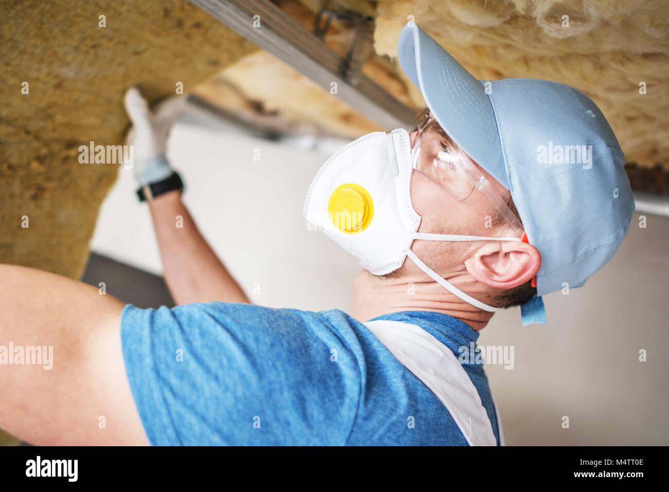 Insulating Material Installation by Caucasian Contractor Worker ...