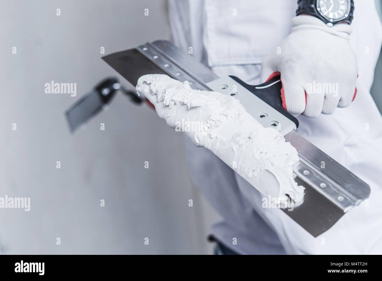 Preparing For Drywall Patch. Patching Tools in Hand of Worker Closeup ...