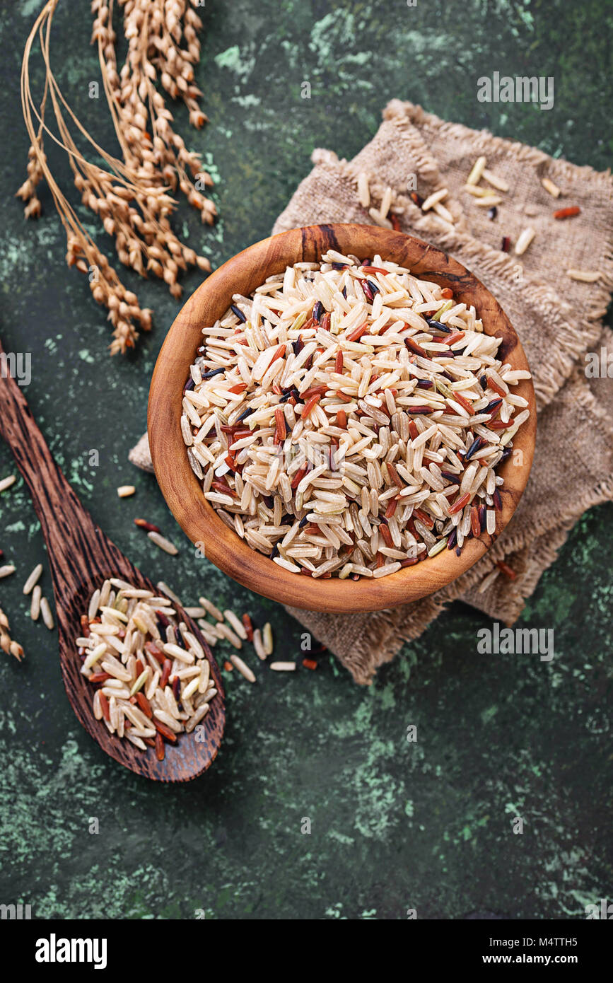 Mix of brown, red and wild rice in bowl Stock Photo - Alamy