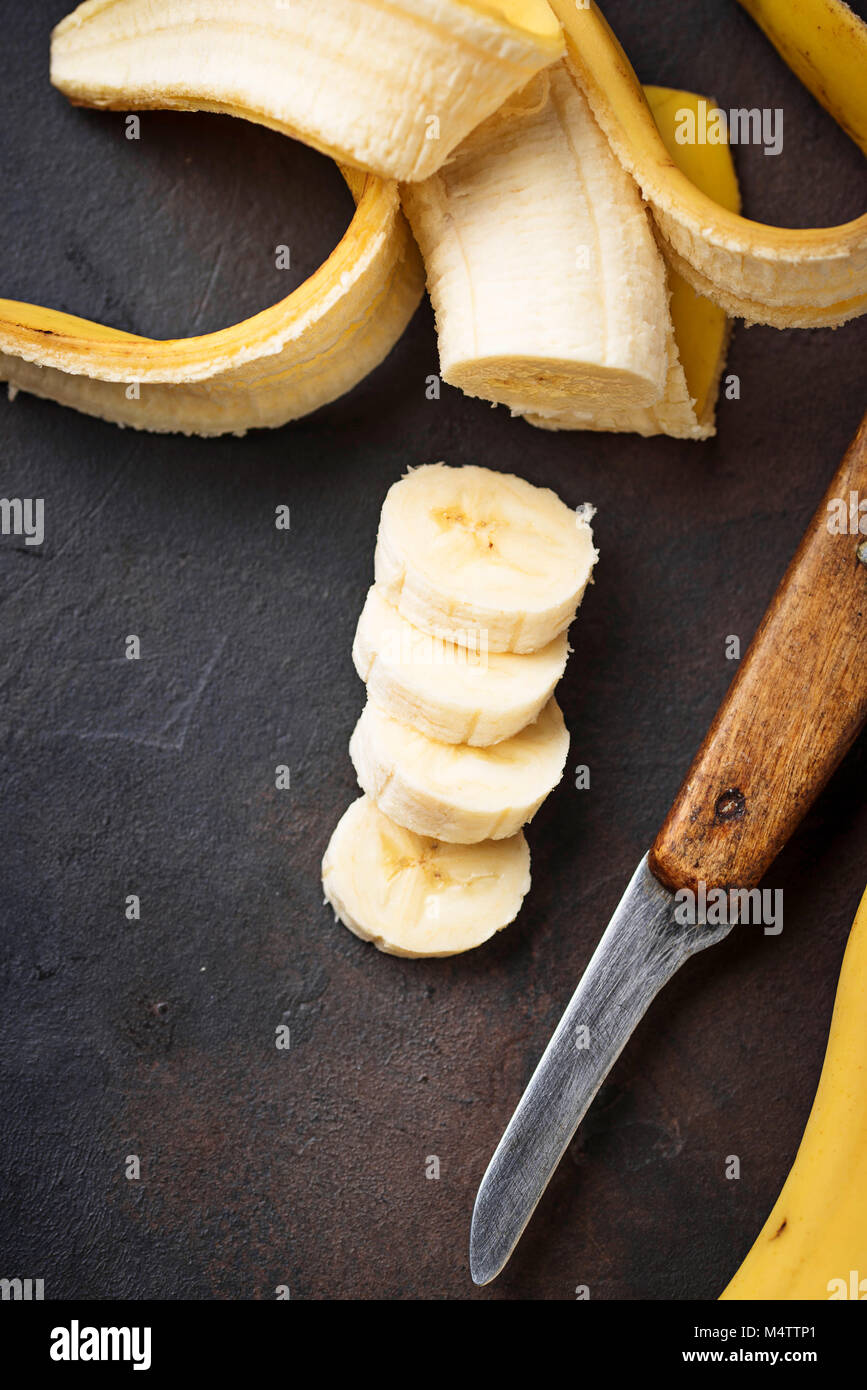 Fresh sliced banana on dark background Stock Photo - Alamy