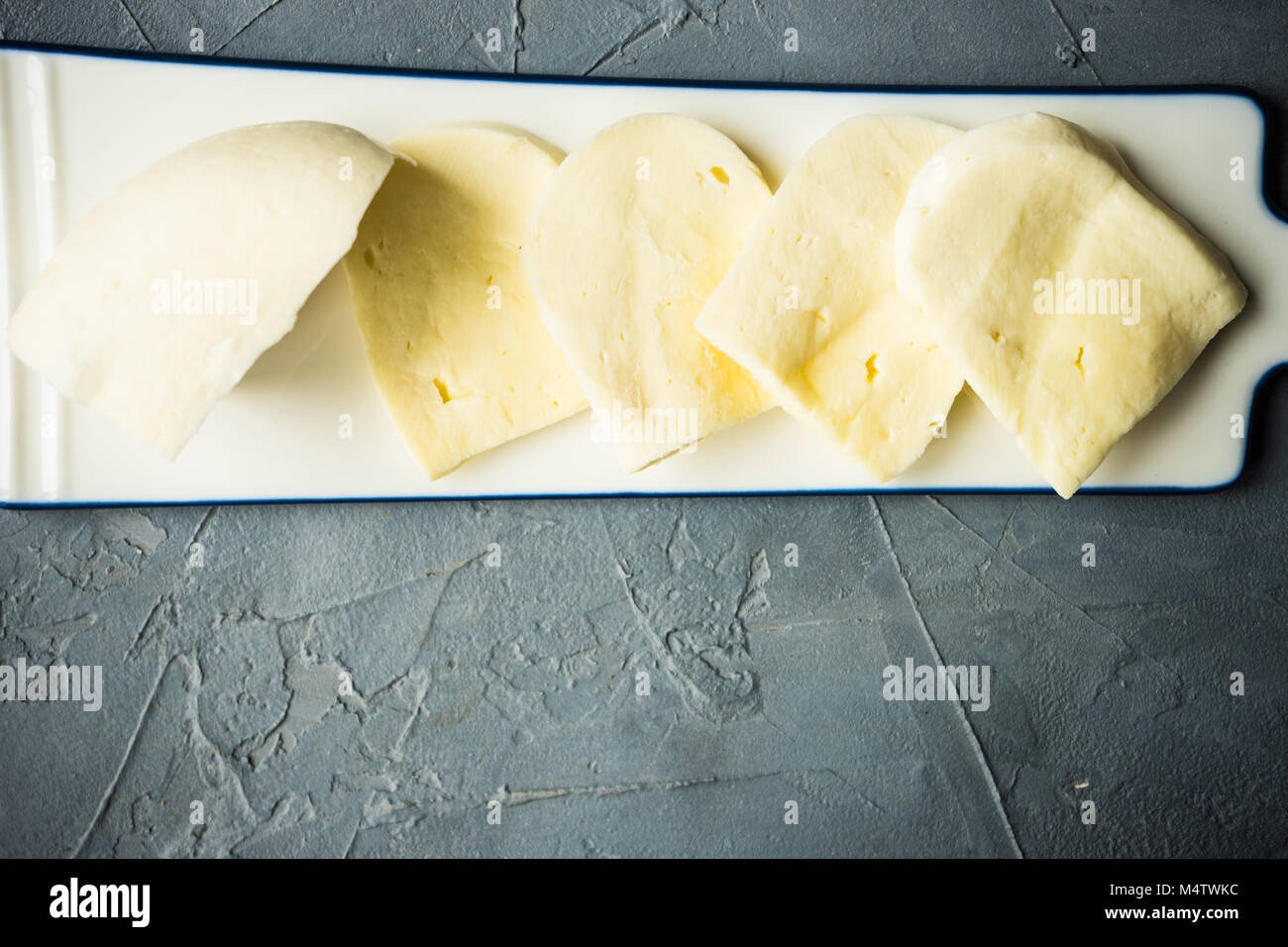 Traditional georgian cheese suluguni on ceramic cutting board Stock ...