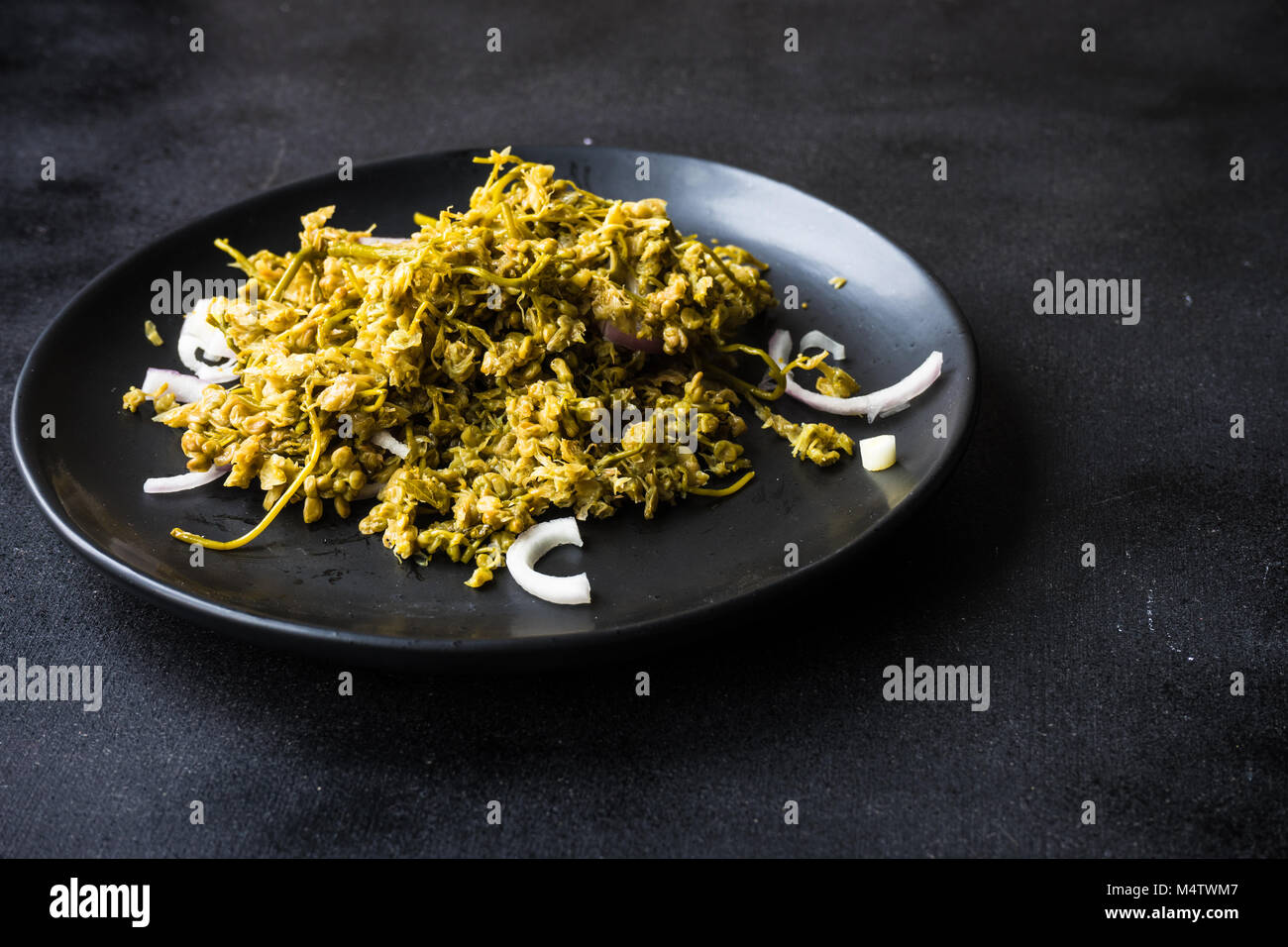 Traditional georgian dish - jonjoli, on rustic table with copyspace ...