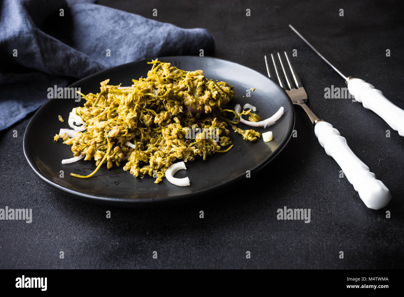 Traditional georgian dish - jonjoli, on rustic table with copyspace ...