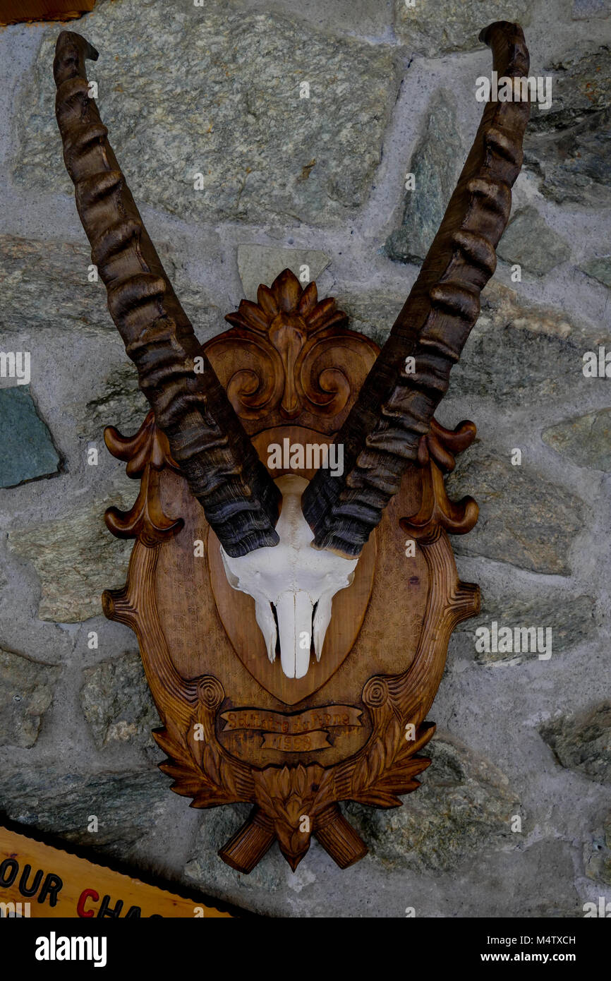 Stag horns in a swiss chalet interior, Valais, Swiss Stock Photo - Alamy