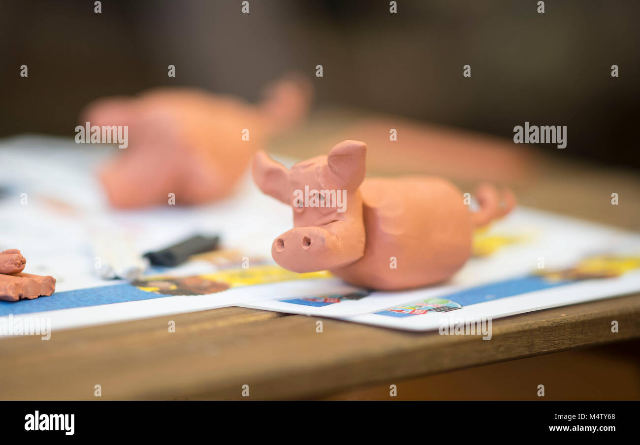 A child making a plasticine model using clay plasticine during a craft ...