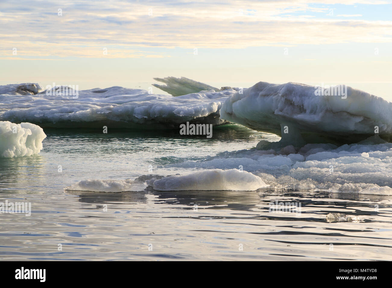 Thawing ice in sea water against sky horizon Stock Photo - Alamy